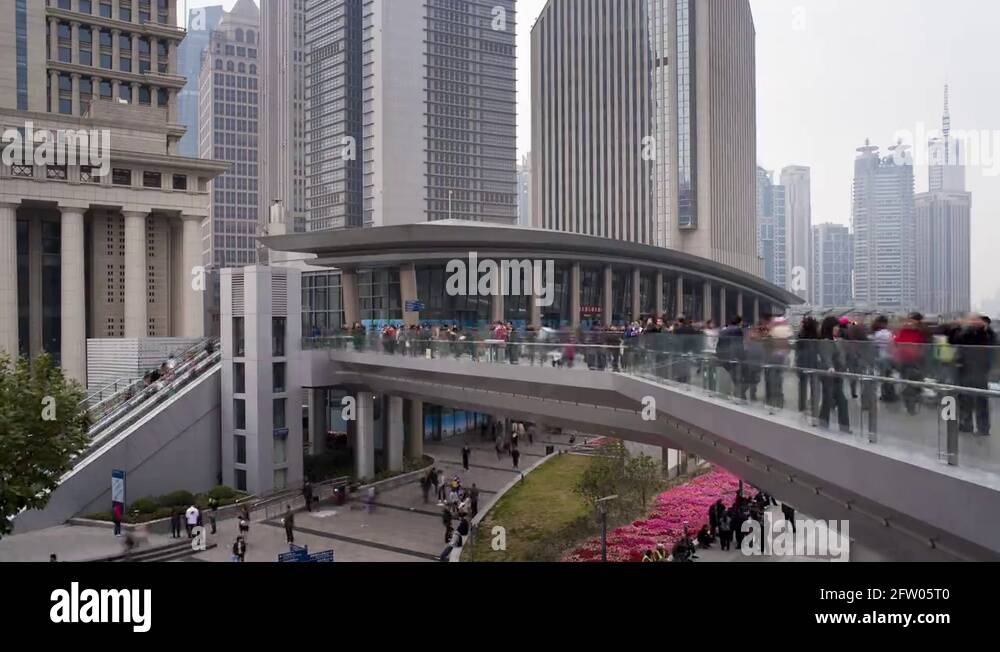 Circular pedestrian walkway with Flags flying above a traffic ...