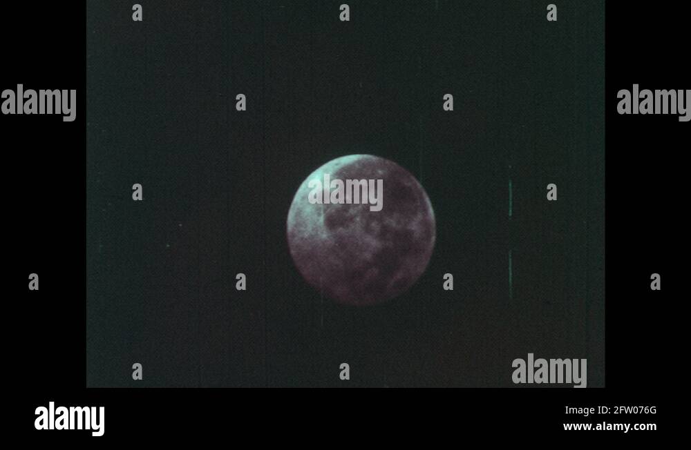 1960s: Moon shines in night sky. View of Earth from space. Pulse ...