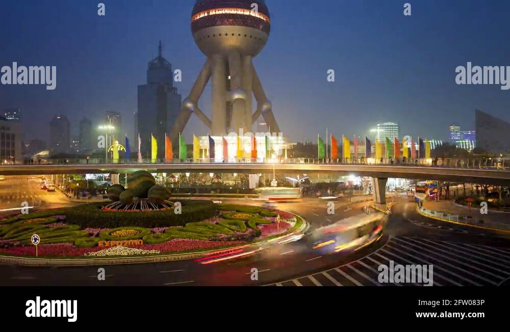 Circular pedestrian walkway with Flags flying above a traffic ...