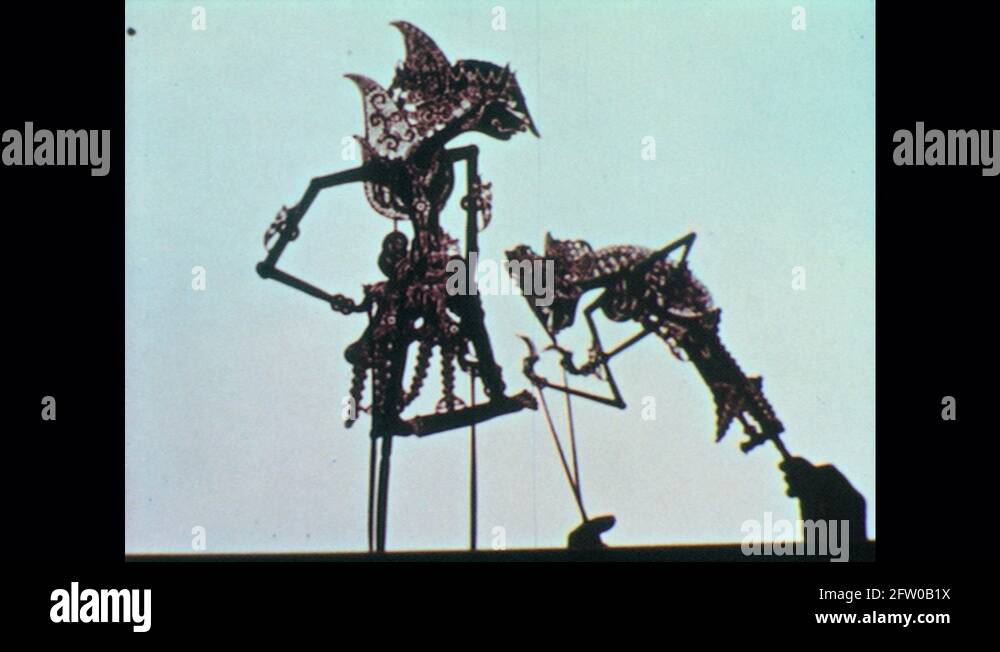 1950s: Shadow puppets. Shadow puppets behind screen. Puppets move ...