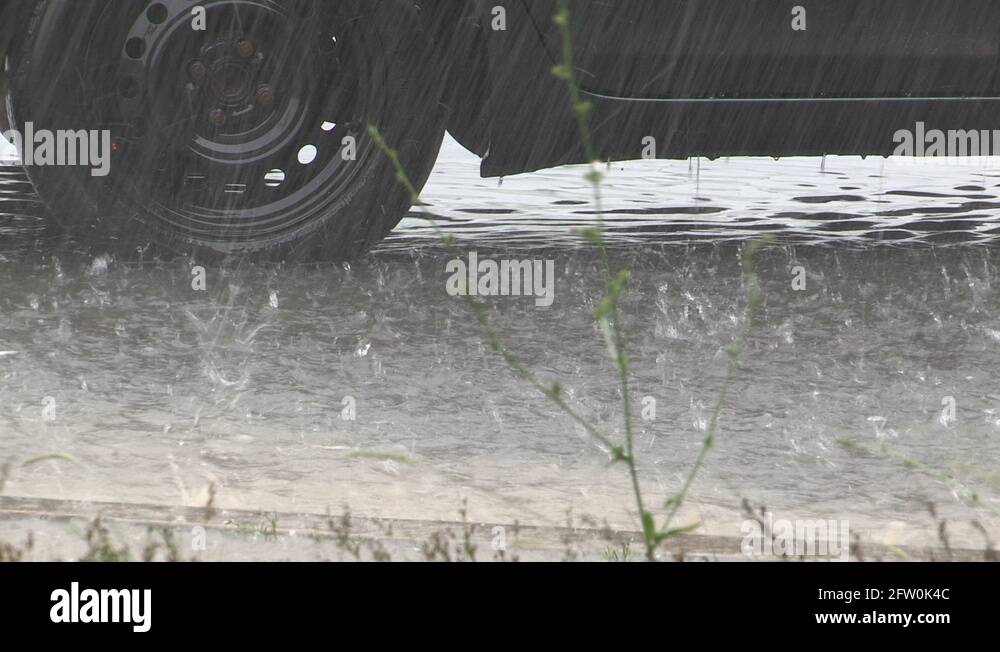 Severe hail rain wind and thunderstorm with cars trapped on city ...