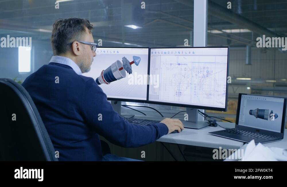 Chief Male Engineer Designs on 3D Model of a Turbine or Engine Part ...