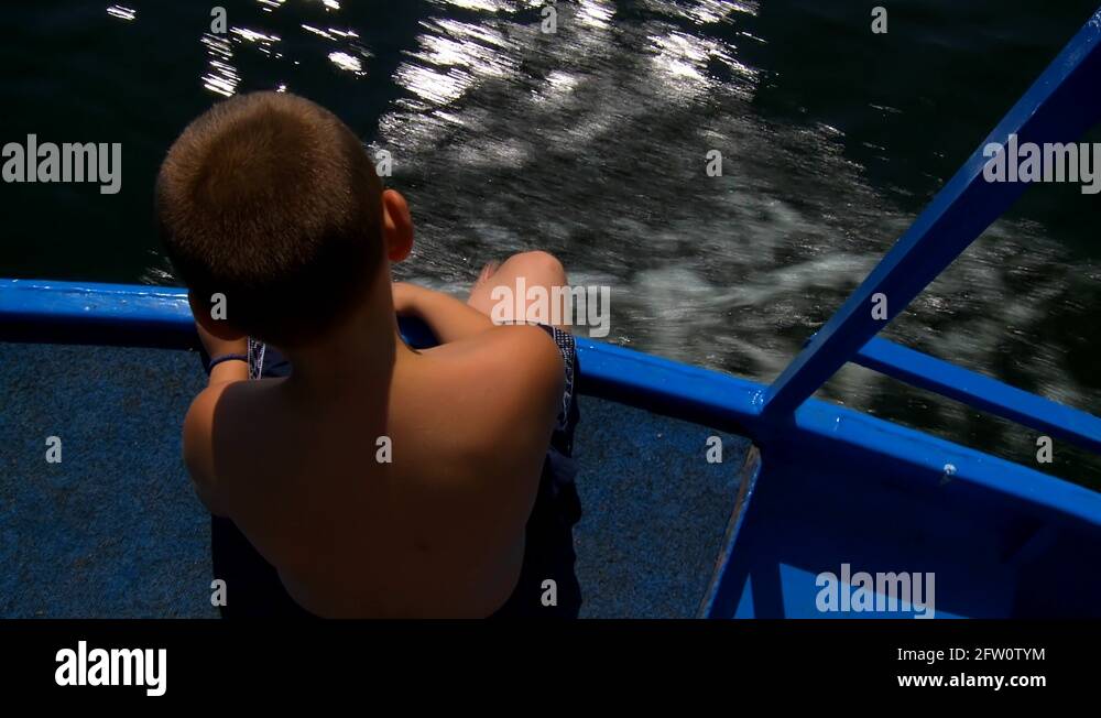 Boy driving boat Stock Videos & Footage - HD and 4K Video Clips - Alamy