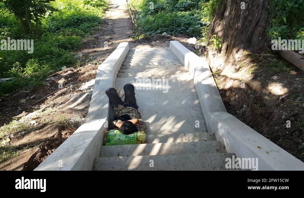 Homeless man sleeping on steps Stock Videos & Footage - HD and 4K Video ...
