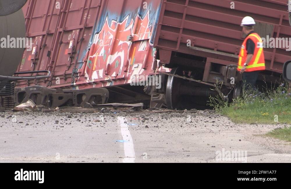 Freight and chemical tanker train derailment in middle of small town ...