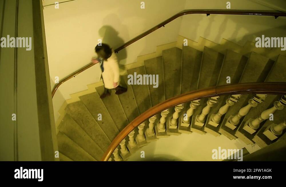 Spiral stairs woman Stock Videos & Footage - HD and 4K Video Clips - Alamy