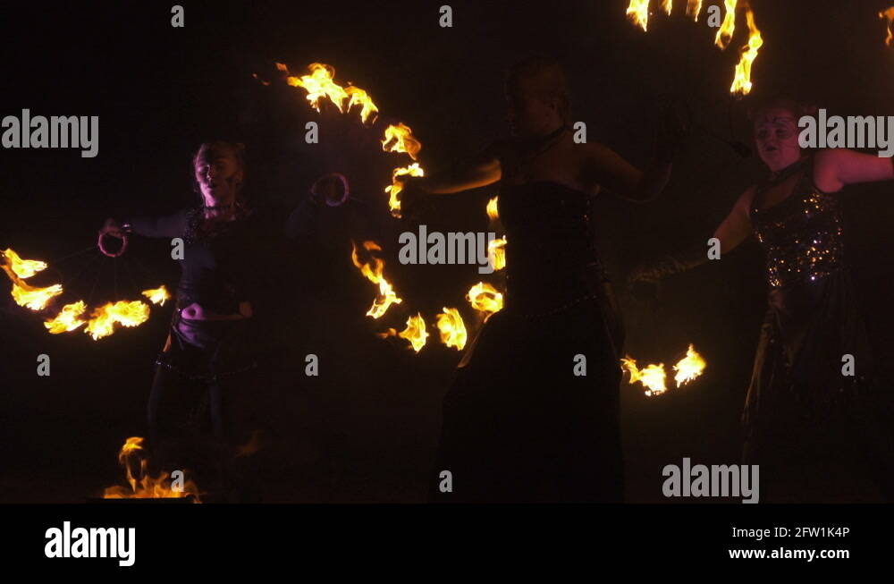 Fiery dance. Amazing magical Fire Show at night. Slow shutter speed. Fire sho Stock Video ...