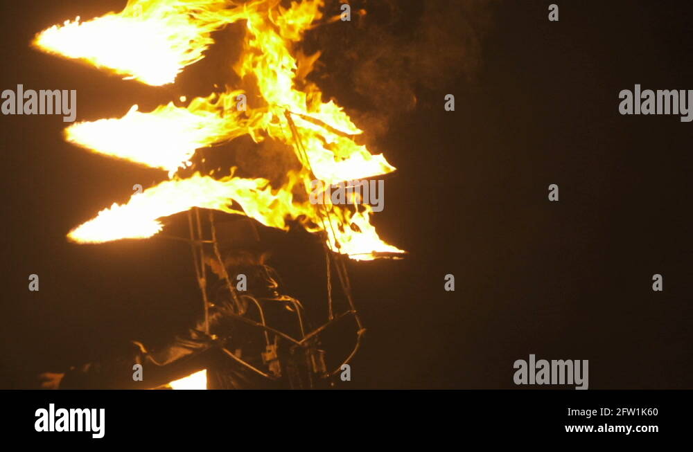 Fiery dance. Amazing magical Fire Show at night. Slow shutter speed ...