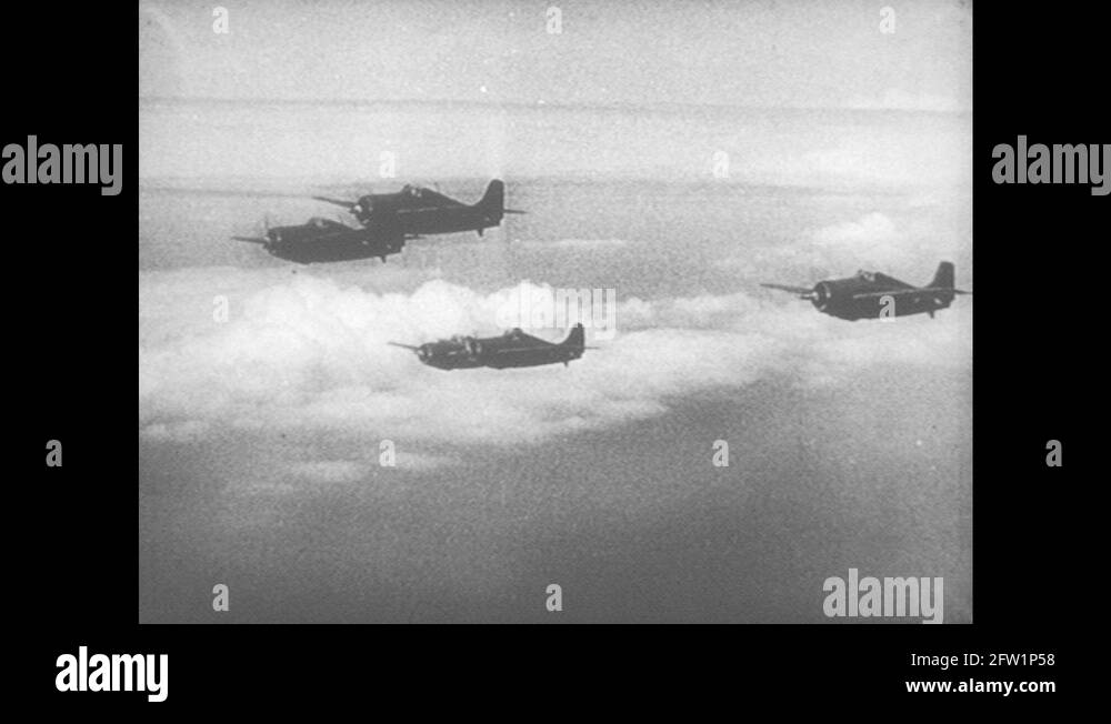 1940s: Naval war planes fly in formation. War plane wing guns fire ...