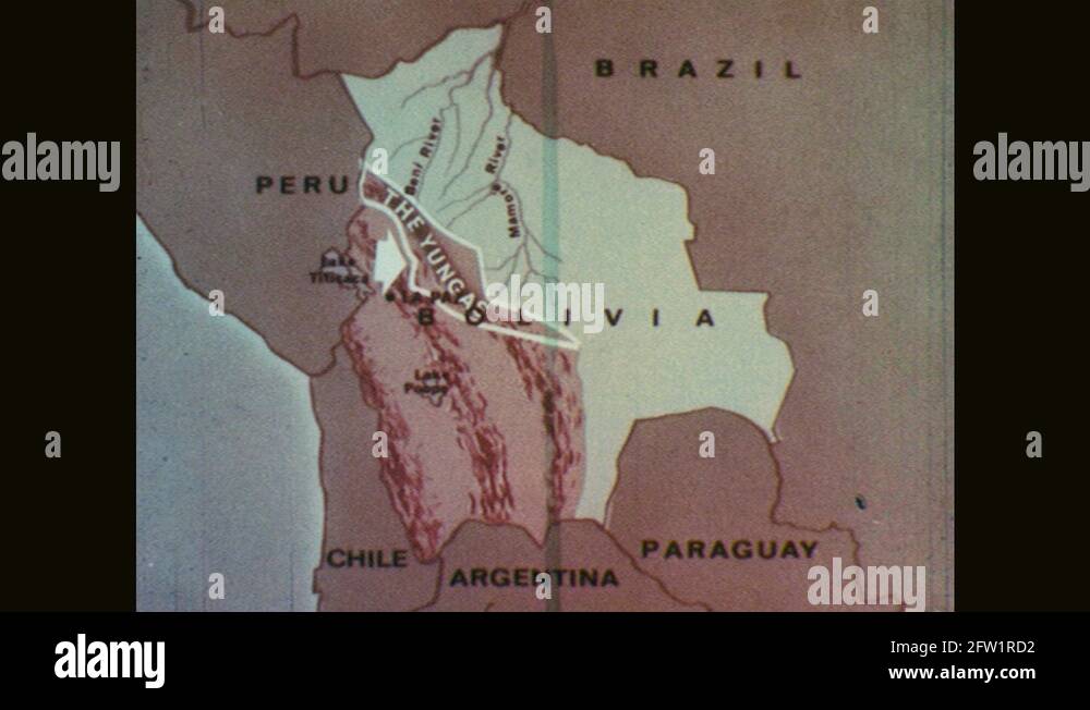 1950s: Map of Bolivia. Village in jungle. Man fishes with bow and arrow ...