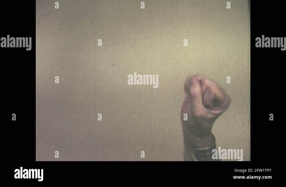 1960s: Raised hand signs alphabet letters in one-hand manual alphabet ...