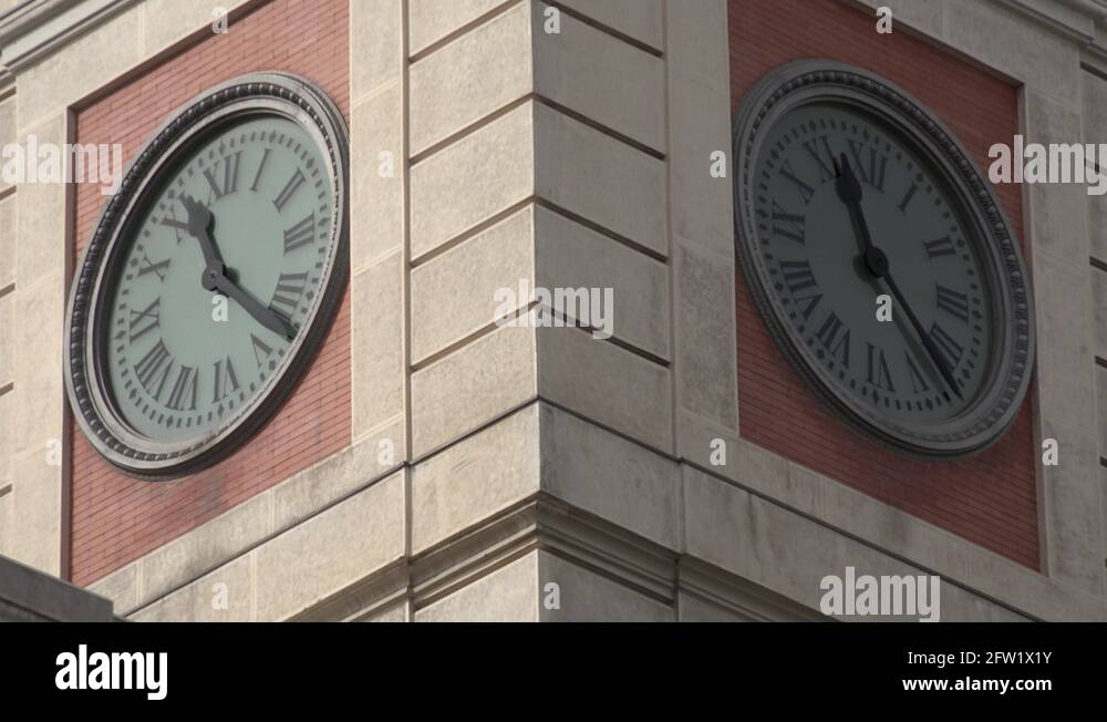 4K Beautiful antique numeral public clock on Madrid tower building hour ...