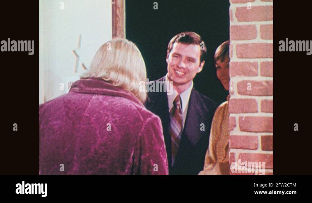 1970s: Man and woman talk in dressing room doorway of actor Jay Garner ...