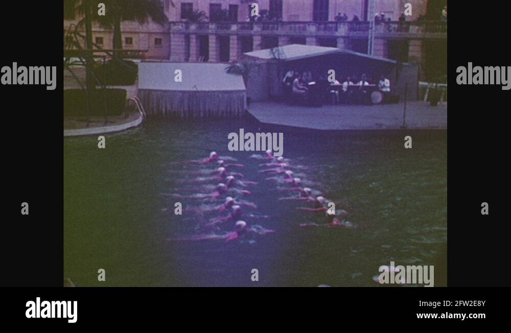 1940s: Ladies, swim in water. Men dive into pool Stock Video Footage ...