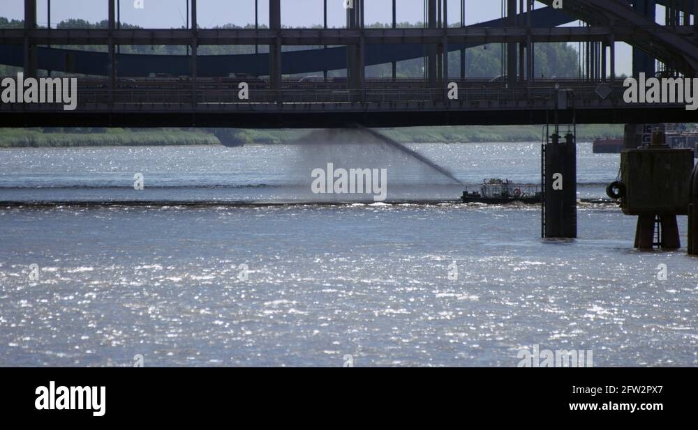 Boat is cleaning a bridge from underneath with a water jet Stock Video ...