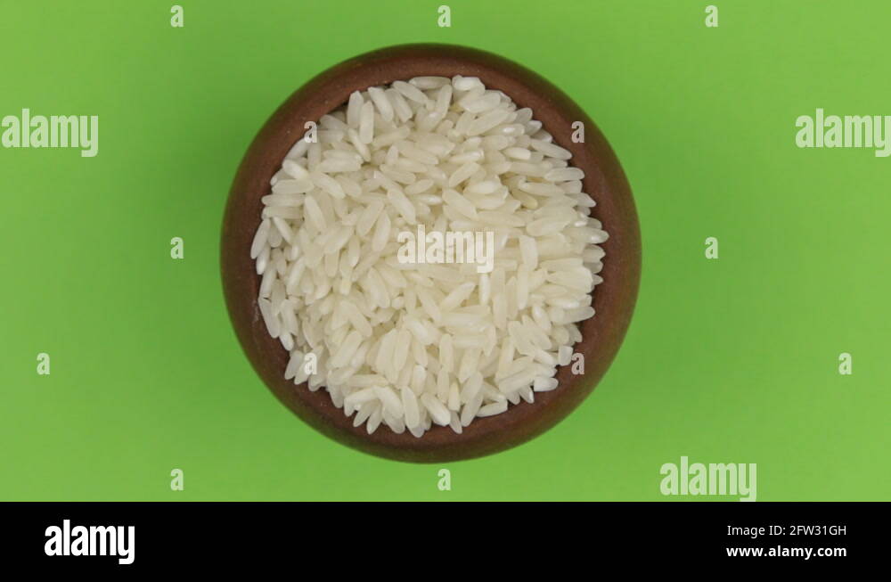 Zoom of a clay pot filled with rice grain. Isolated green screen Stock ...