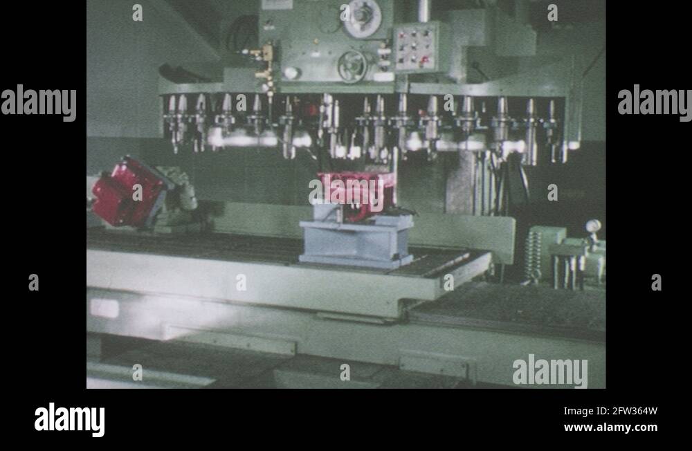 1960s: Objects on moving tray. Tools hang above moving tray Stock Video ...