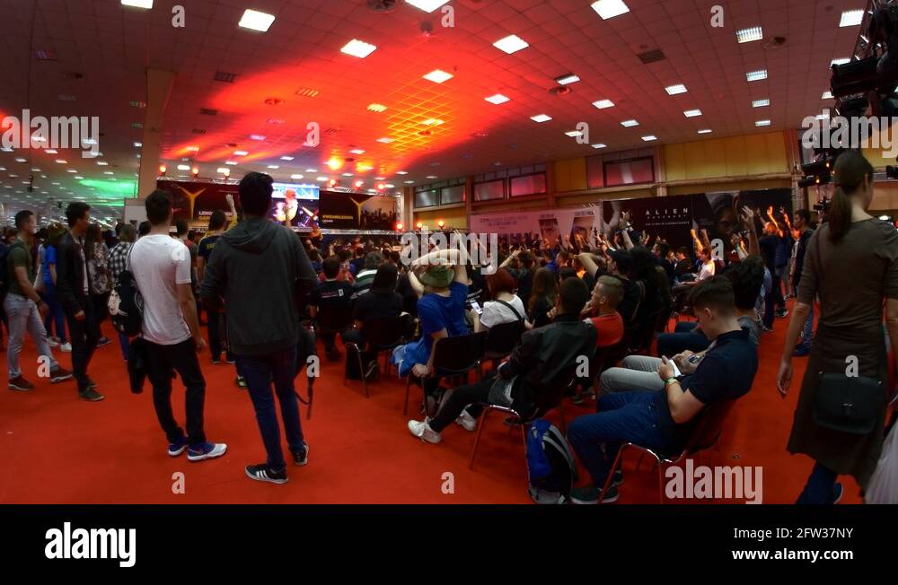 Pannel Hall On A Very Big Convention, People Walking By, ComicCon Stock ...
