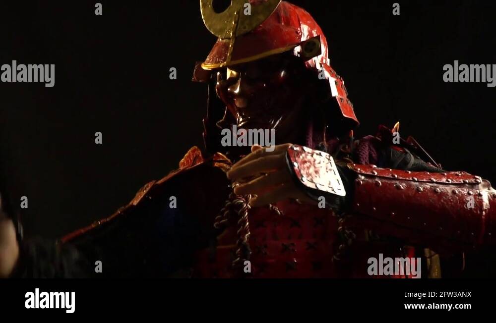 Samurai in red armor and mask attacks katana Stock Video Footage - Alamy