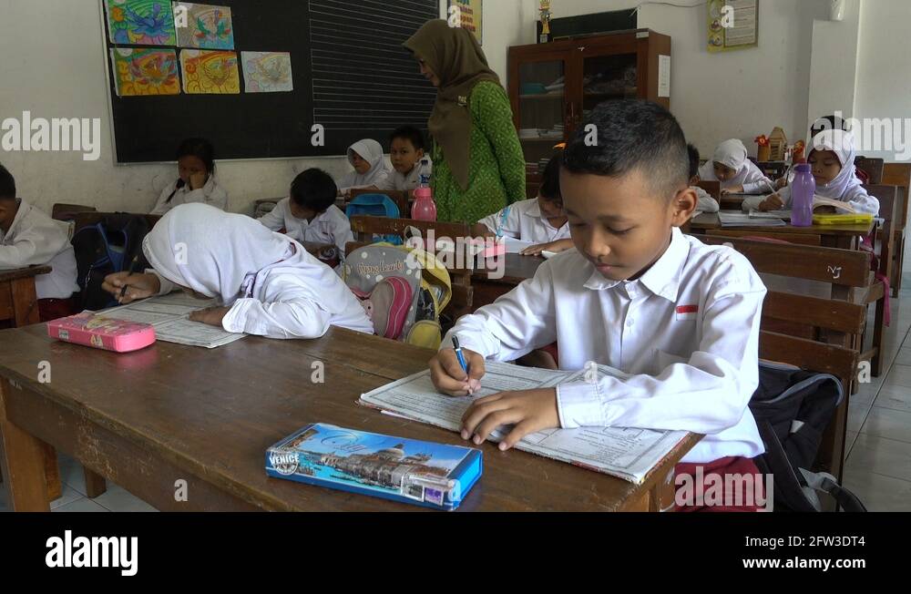 Young elementary school students in classroom, education in Indonesia ...