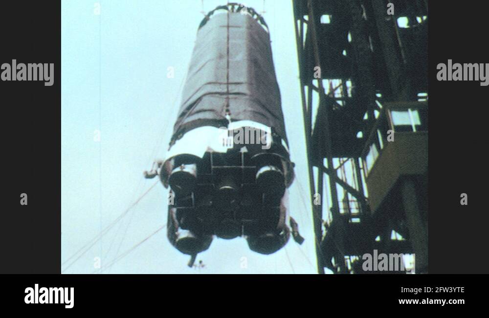 1960s: The Saturn C-1 rocket booster is erected at the launch site ...