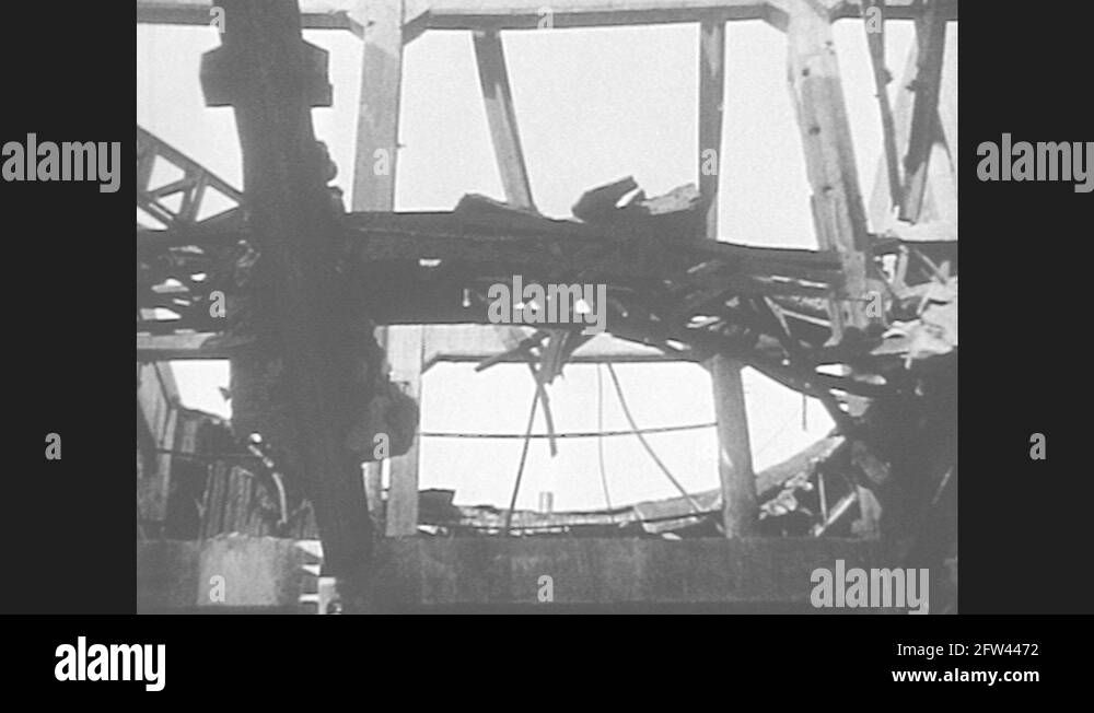 JAPAN 1940s: Exposed steel beams in roof of bombed-out train station ...