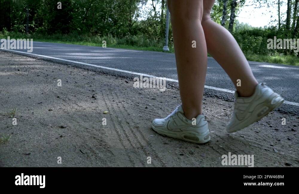 Woman feet walking side view. Woman legs isolated close up Stock Video ...