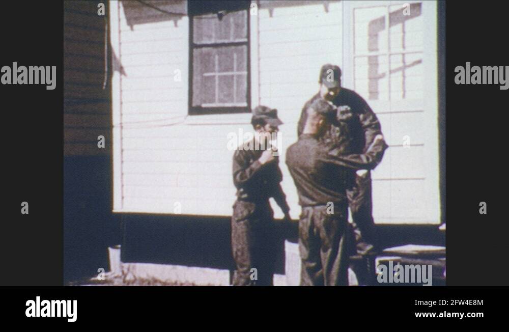 1970s: Military men look at paper. People sit at conference table ...