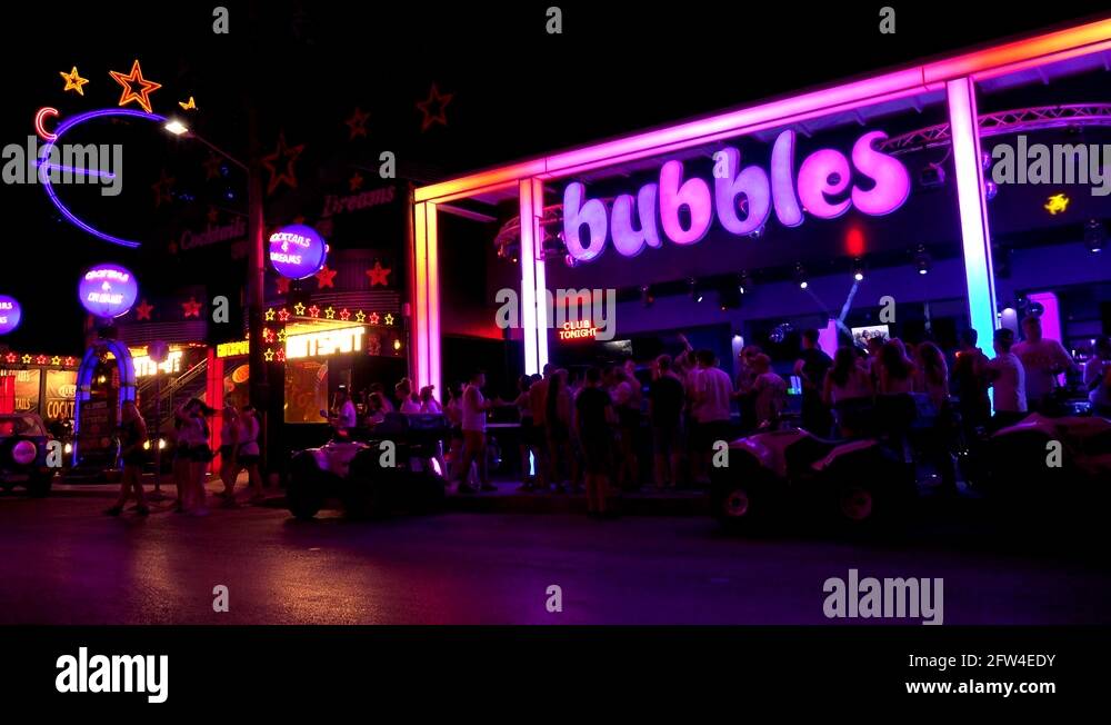 4K Timelapse people walk in Laganas night resort famous nightclubs in ...