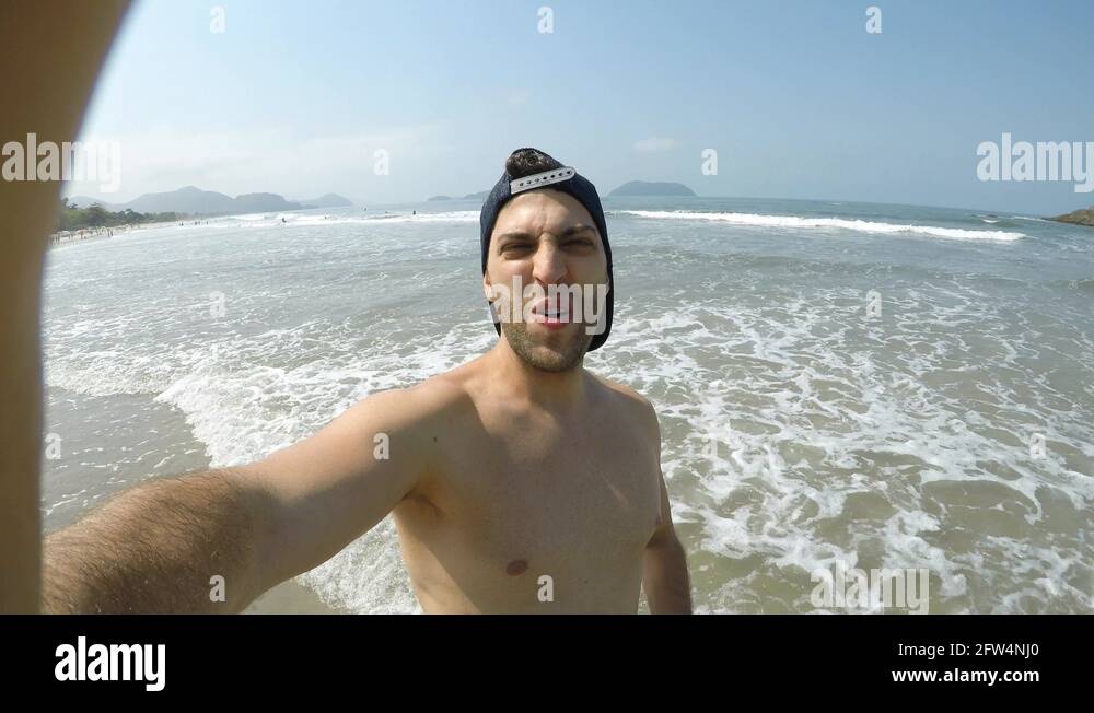 Brazilian Man taking a selfie in the Beach Stock Video Footage - Alamy