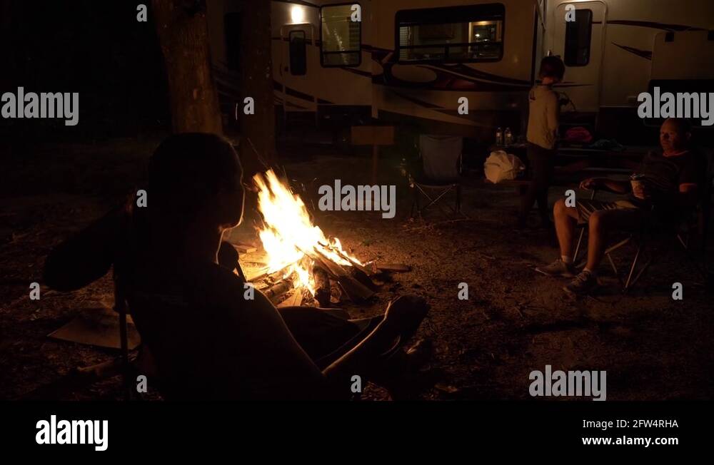 Friends Sit Around a Campfire in Front of 5th Wheel Trailer Stock Video ...
