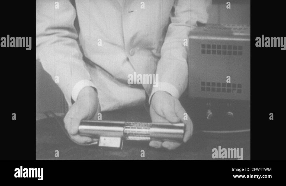 1950s: Man In White Suit Handles Probe Of Geiger Counter. Man Points To ...