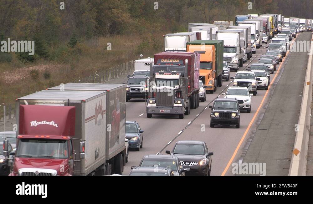 Tractor trailer trucks stuck in epic highway traffic jam and gridlock ...