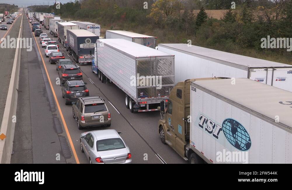 Tractor trailer trucks stuck in epic highway traffic jam and gridlock ...