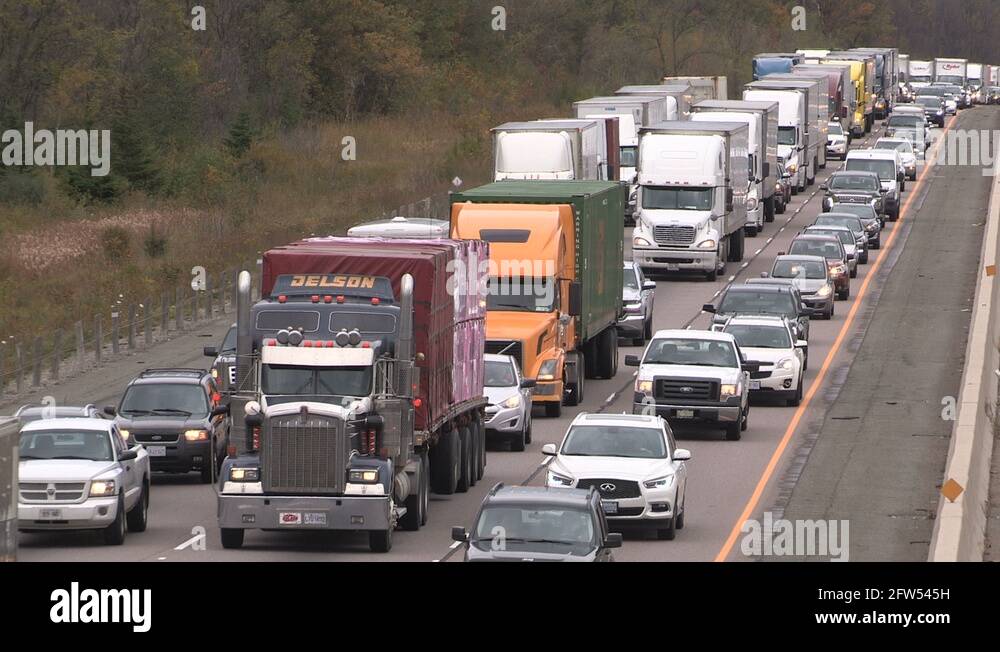 Tractor trailer trucks stuck in epic highway traffic jam and gridlock ...