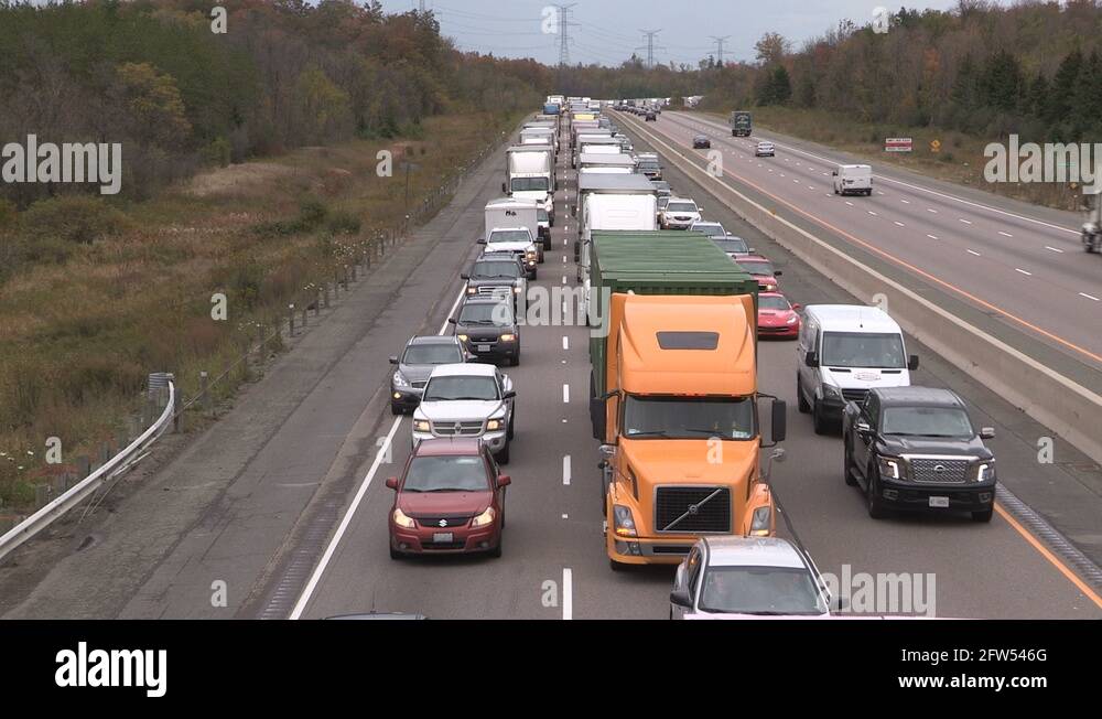 Tractor trailer trucks stuck in epic highway traffic jam and gridlock ...