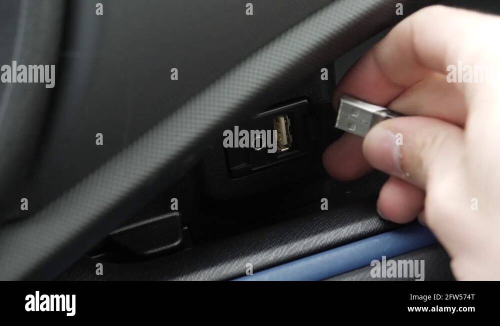 Inserting a USB Flash Drive into a Port Located Inside a Car Stock ...