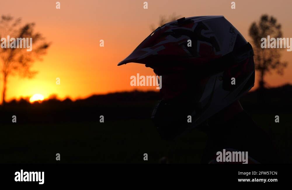 motocross rider devil horns rock on and head bang sunset 4k Stock Video ...