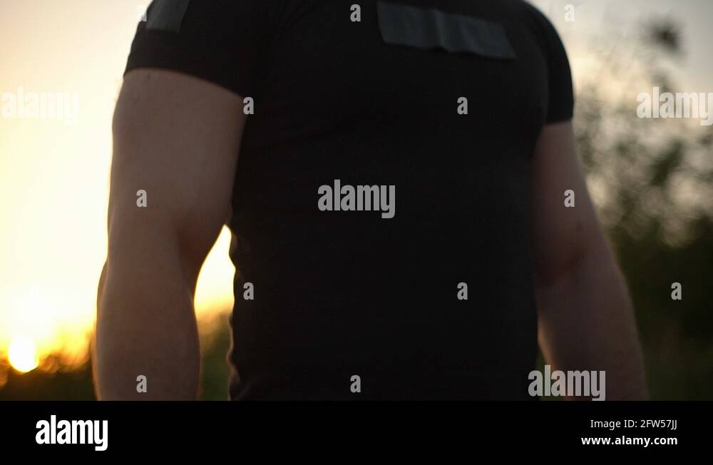 from top to down picture of male body wearing T-shirt and shorts ...