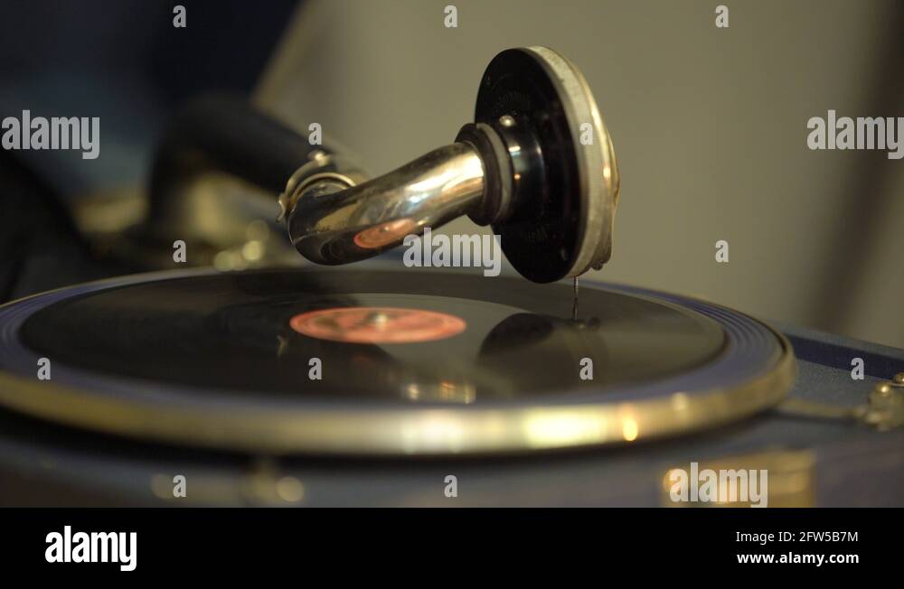 Gramophone with a vinyl record in a retro interior. Phonograph plays ...