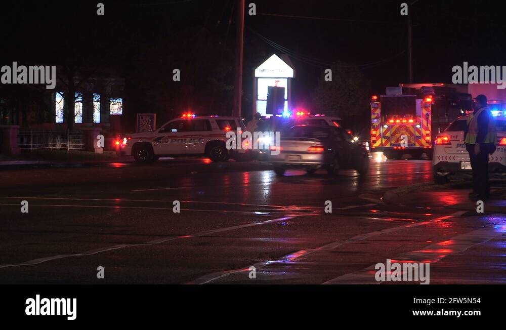 Car accident in dark city intersection with police and at scene at ...