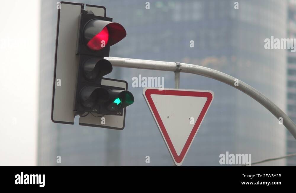 Traffic light and road sign on building background. Close-up Stock ...