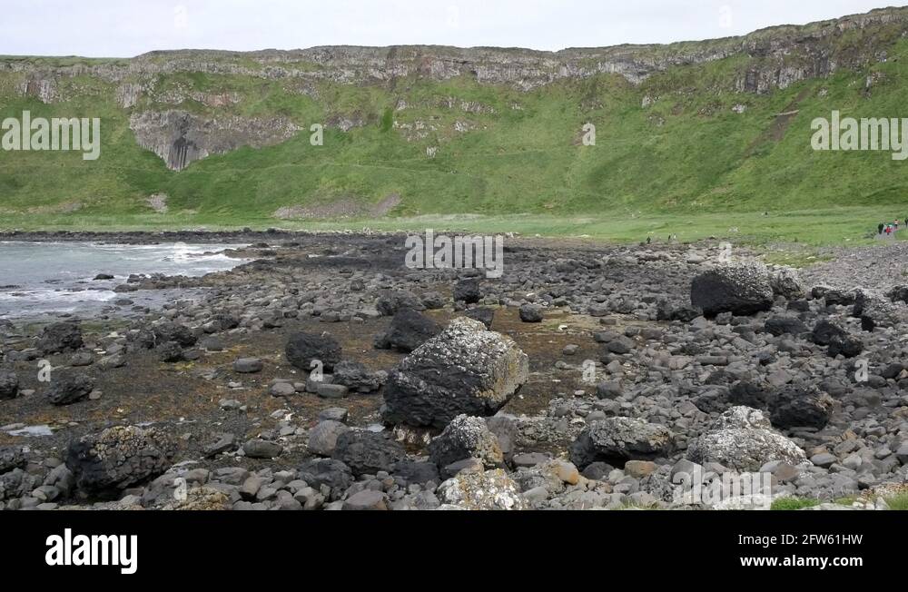 Northern Ireland rocks in front of cliffs at Giants Causeway Stock ...