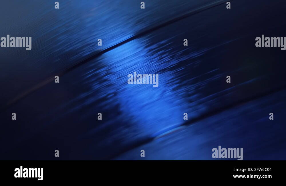 Structure, texture, surface pattern of vinyl disc. Color illumination ...