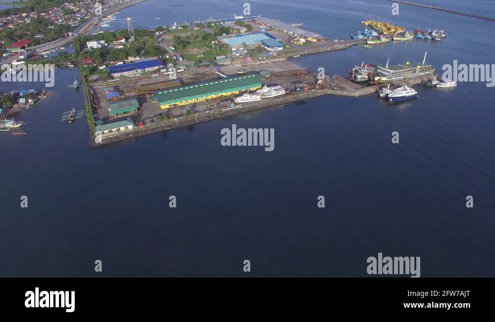 Fishing port and dock yard where boats are anchored side by side. Drone ...