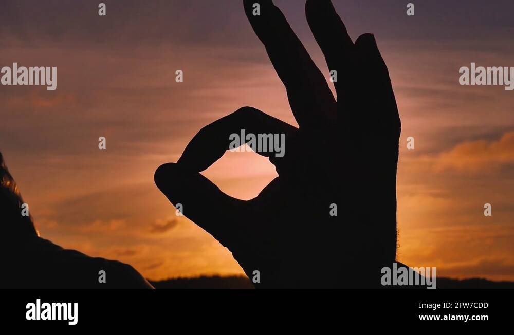 Silhouette ok hand on beautiful sunset background. OK symbol Stock ...