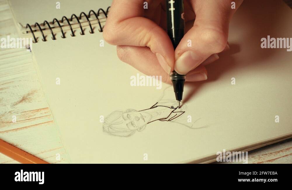 girl drawing a sketch with the pencil at her notepad 4 Stock Video ...