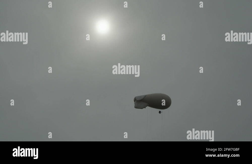 Airships Zeppelin gas helium floating in the sky in sun background on ...