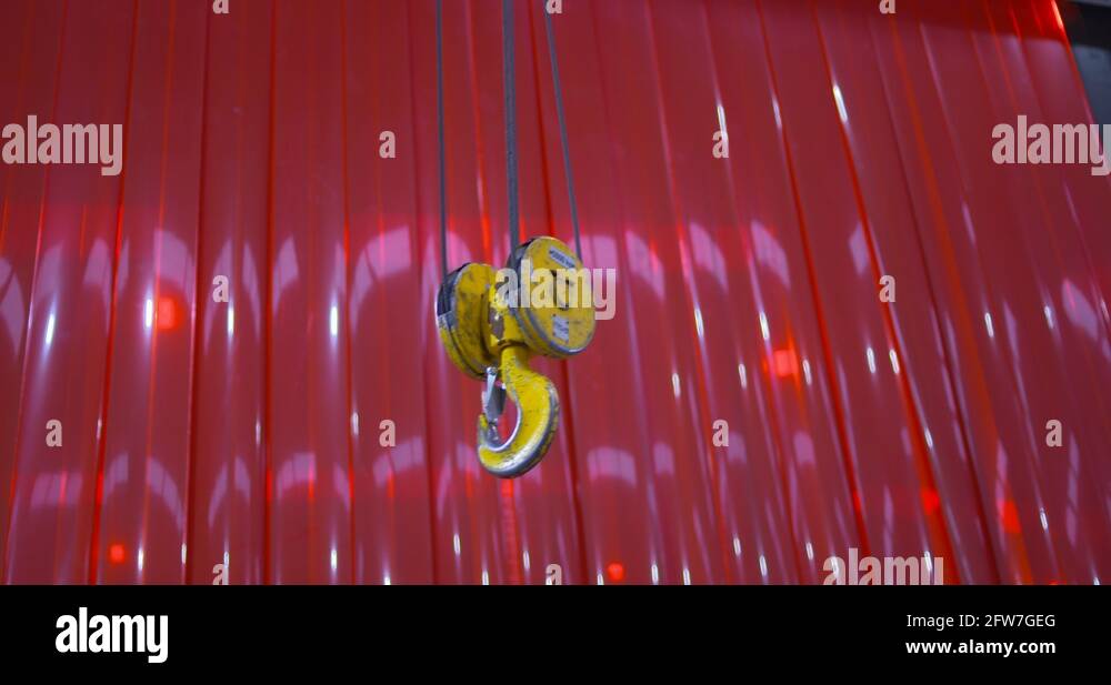 Large yellow gantry winch hook overhead factory safety hazard Stock ...