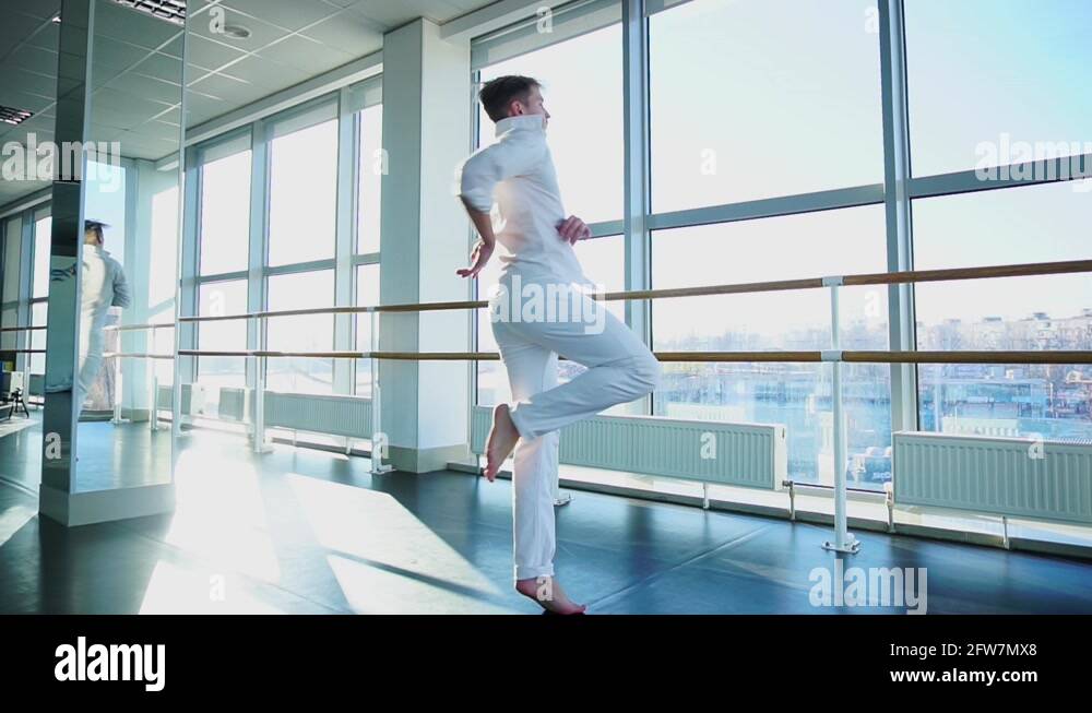 Guy spotting in white suit and raving at studio Stock Video Footage - Alamy